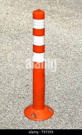 Orange traffic reflective bollards. Traffic Sign or traffic pole on the ...