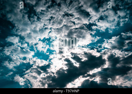 texture of blue sunny sky with gloomy clouds. Design wallpaper with ...