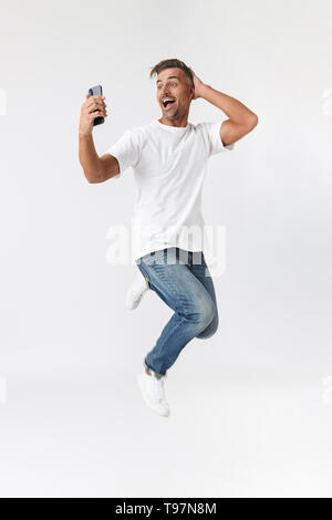 Full length photo of cheerful positive guy dressed striped t-shirt ...