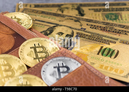 Bitcoins wallet and dollar banknotes Stock Photo - Alamy