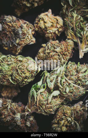 Detail of legal marijuana flowers photographed on paper background ...