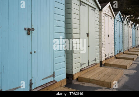 Beach huts at Avon Beach Mudeford stretching into distance Stock Photo ...