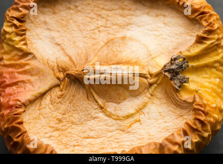 Slice of withered apple on a dark background. Selective focus Stock ...