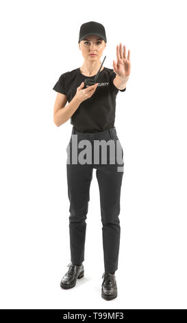 Female security guard showing stop gesture outdoors Stock Photo - Alamy