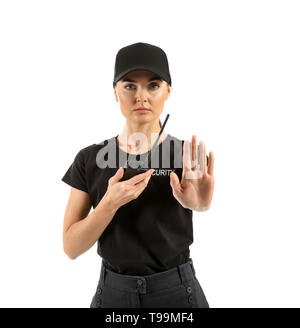 Female security guard showing stop gesture outdoors Stock Photo - Alamy