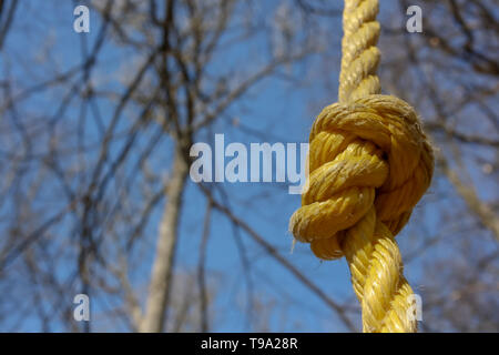Detail of yellow rope climbing frame for children and adults in ...