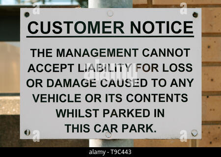 Disclaimer notice at a car park Stock Photo - Alamy