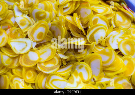 Colorful variety of fryums ready to fry snacks in an indian market ...