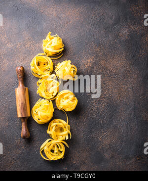 Raw uncooked homemade pasta tagliatelle or fettuccine Stock Photo - Alamy