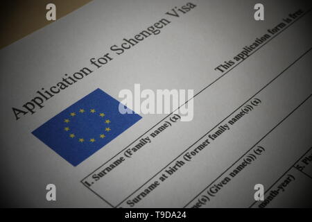 Schengen visa stamp in international passport. Shengen document for ...