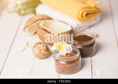 Body scrub of ground coffee, coconut oil, and sugar in glass jar on ...