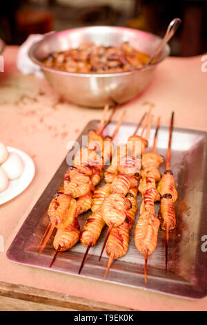 Tree worms named Suri for sale as food on a stall at Belen Market or ...