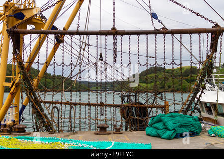 Beam trawler chains raised on booms Stock Photo - Alamy