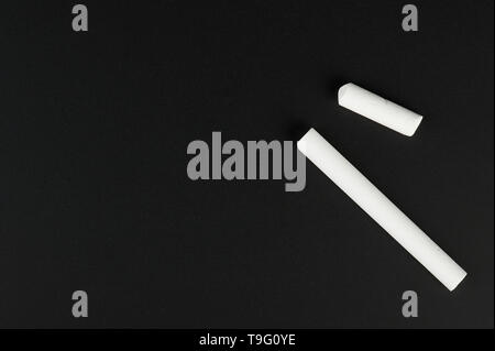 Two pieces of chalk on chalkboard with chemical formula Stock Photo - Alamy