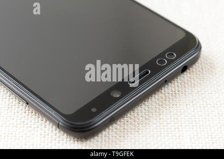 Close-up detai view of cellphone front camera, sensors and loudspeaker ...