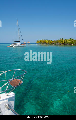 Cruising catamaran at North Long Coco Plum Caye, Belize Stock Photo - Alamy