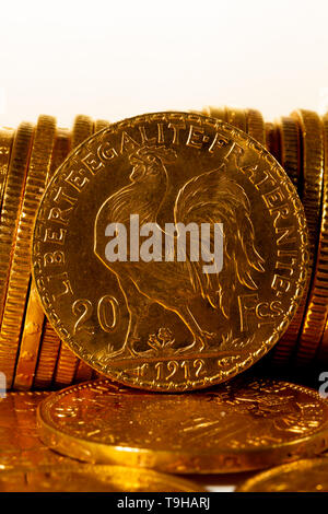 Real Gold coins over dark background Stock Photo - Alamy