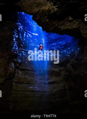 A potholer is winched into Gaping Gill, the largest cavern in Britain ...