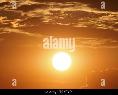 Marvelous sun set with clouds formation seen from european city of ...