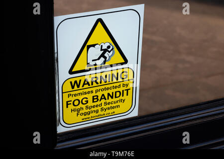 Fog Bandit warning sign displayed on jewellers door, high speed ...