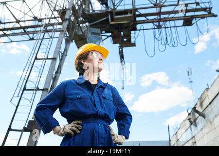 Confident female builder posing at construction site indoors Stock ...