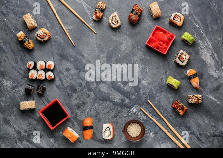 Frame made of different sushi on grey background Stock Photo - Alamy