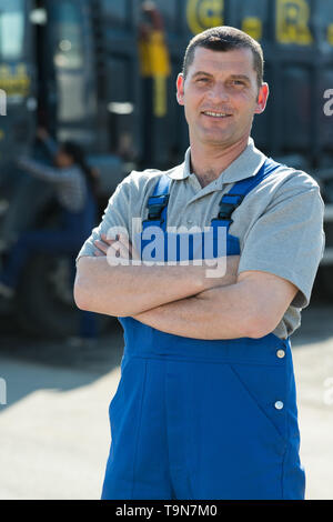 mechanic man or smith repairing car at workshop Stock Photo - Alamy