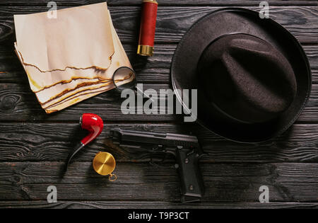Composition with different items for detective on wooden table Stock ...