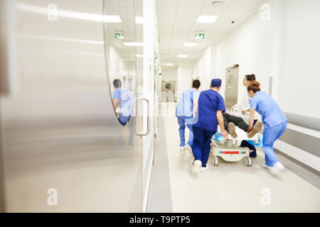 Doctor and medical running with patient bed in hospital emergency Stock ...