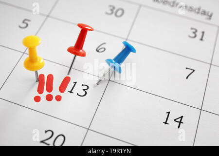 Calendar with pinned date and exclamation marks, closeup Stock Photo ...