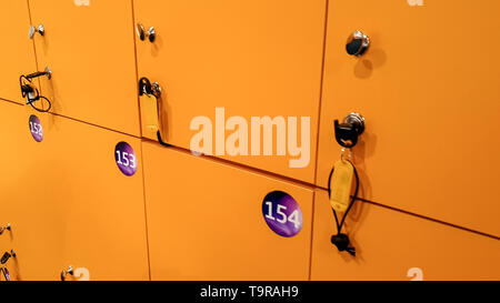 Closeup image of yellow lockers in the dressing room at gym Stock Photo ...