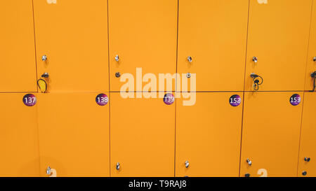 Closeup image of yellow lockers in the dressing room at gym Stock Photo ...