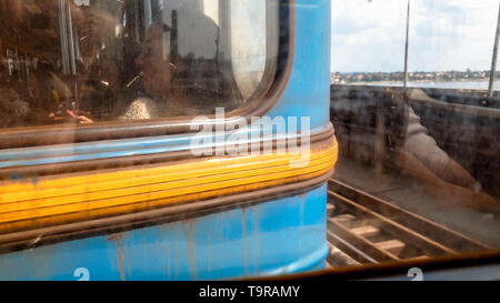 Closeup toned image of sad tired people riding in dirty rusty subway ...