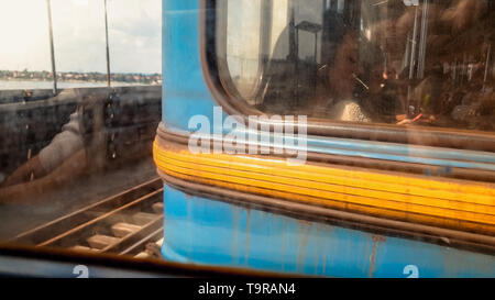 Closeup toned image of rusty dirty old metro car riding on the bridge ...