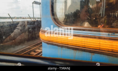Closeup toned image of rusty dirty old metro car riding on the bridge ...