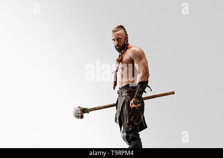 Half length portrait of muscular soldier in field uniform with sniper ...