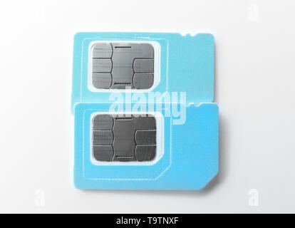 two color sim cards on a white background Stock Photo - Alamy