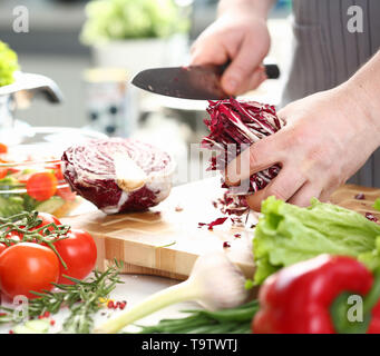 Board with pieces of fresh purple cabbage on grey background Stock ...