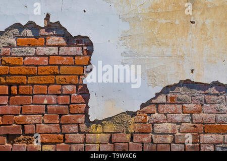 old brick and stucco wall, with deteriorating brick and mortar Stock ...