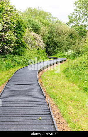 A raised footpath or boardwalk made from recycled plastic at the ...