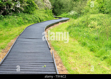 A raised footpath or boardwalk made from recycled plastic at the ...