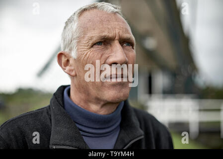 Portraits of a Dutch miller at his windmill in the Netherlands Stock ...