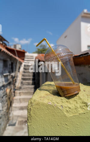 abandoned old plastic drinking cup with coffee Stock Photo - Alamy