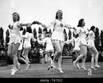Women do different exercises in a sports competition of the Nazi ...