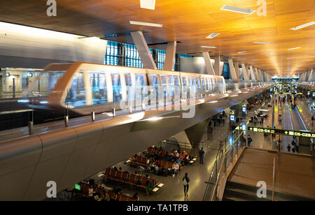 Elevated passenger shuttle train in terminal building at Hamad ...