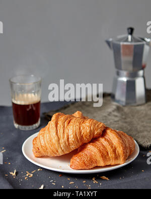 Plate with geyser coffee maker, delicious cookies and cup of espresso ...