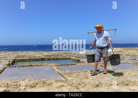 Portrait of man working in the saltern in Gozo. Malta Stock Photo - Alamy