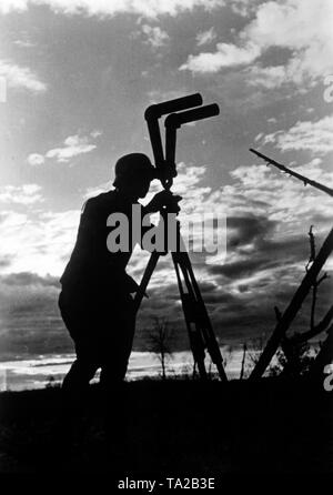 Photo of an artillery spotter or military observer launches a drone ...