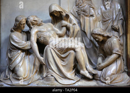 A sculpture of Jesus Christ in the arms of Mary Magdalene following ...