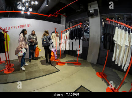 Fans of the Koran K-Pop band BTS shop for band â€œmerchâ€ at a pop-up ...